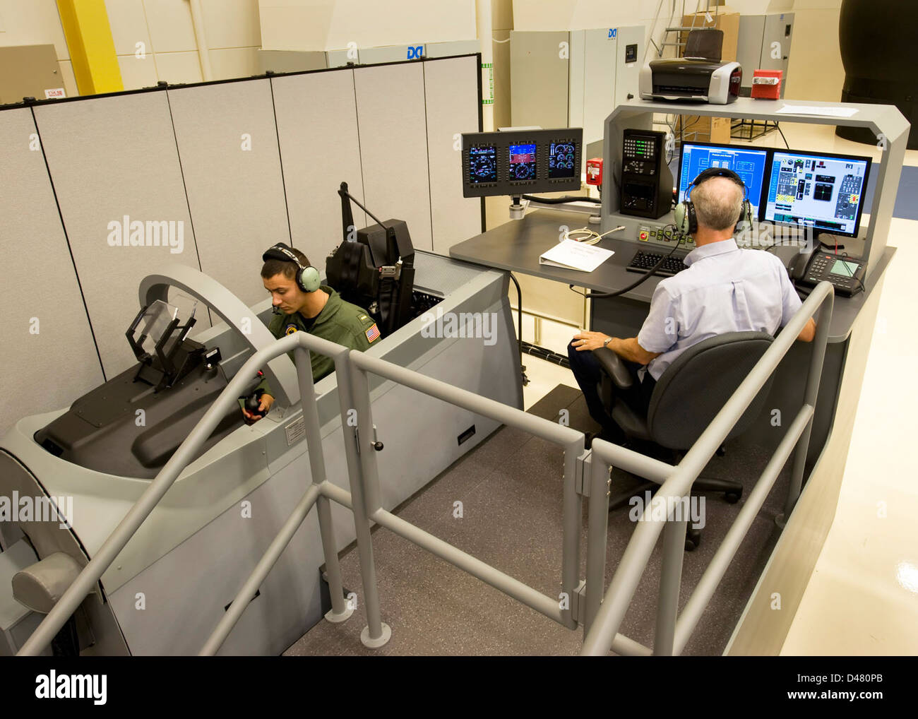 Simulator instructor provides training hi-res stock photography and ...