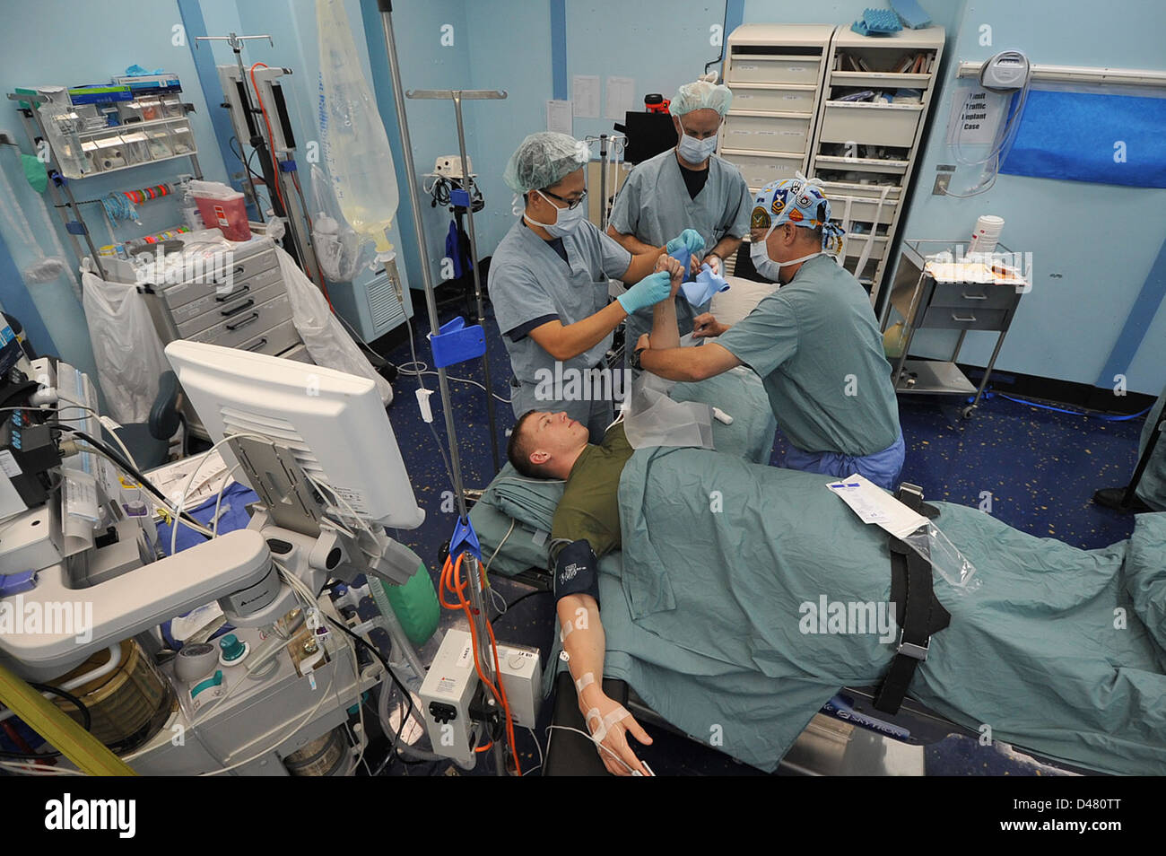 Surgical staff aboard a U.S. Navy ship in the Pacific Ocean prepare for ...