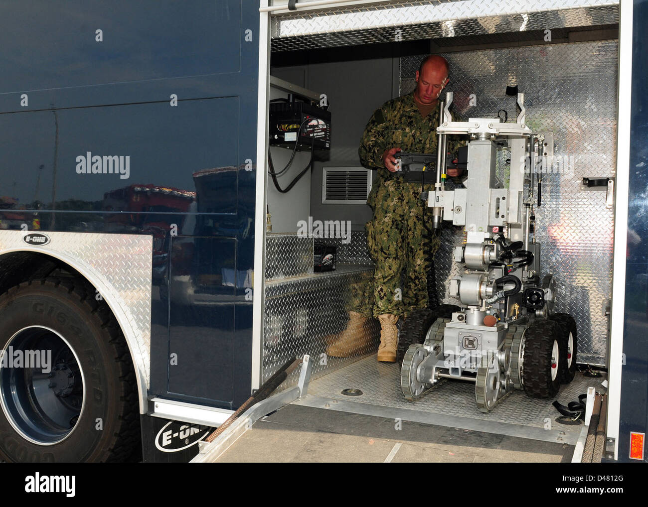 A Sailor operates a F6-A EOD robot during a training exercise at Joint ...