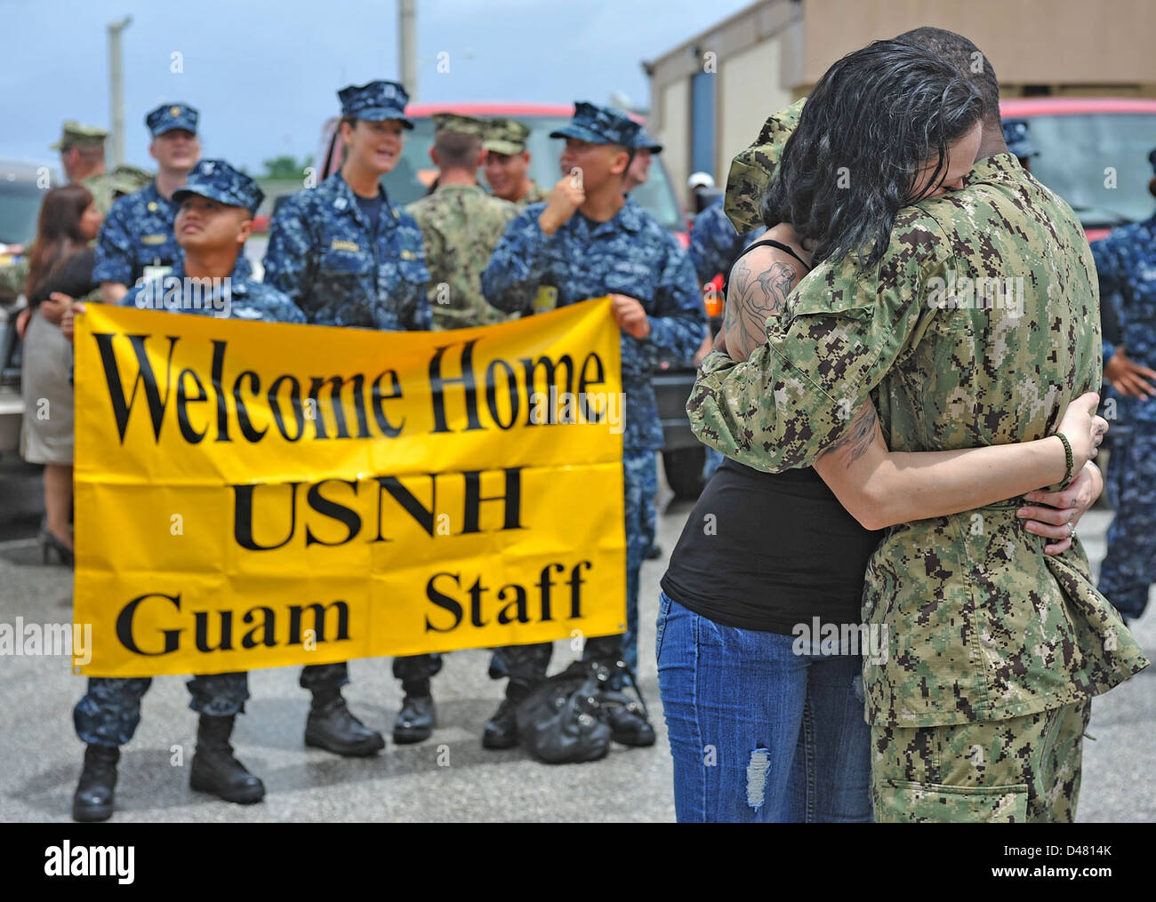 A Sailor hugs his wife pier side in Guam Stock Photo - Alamy