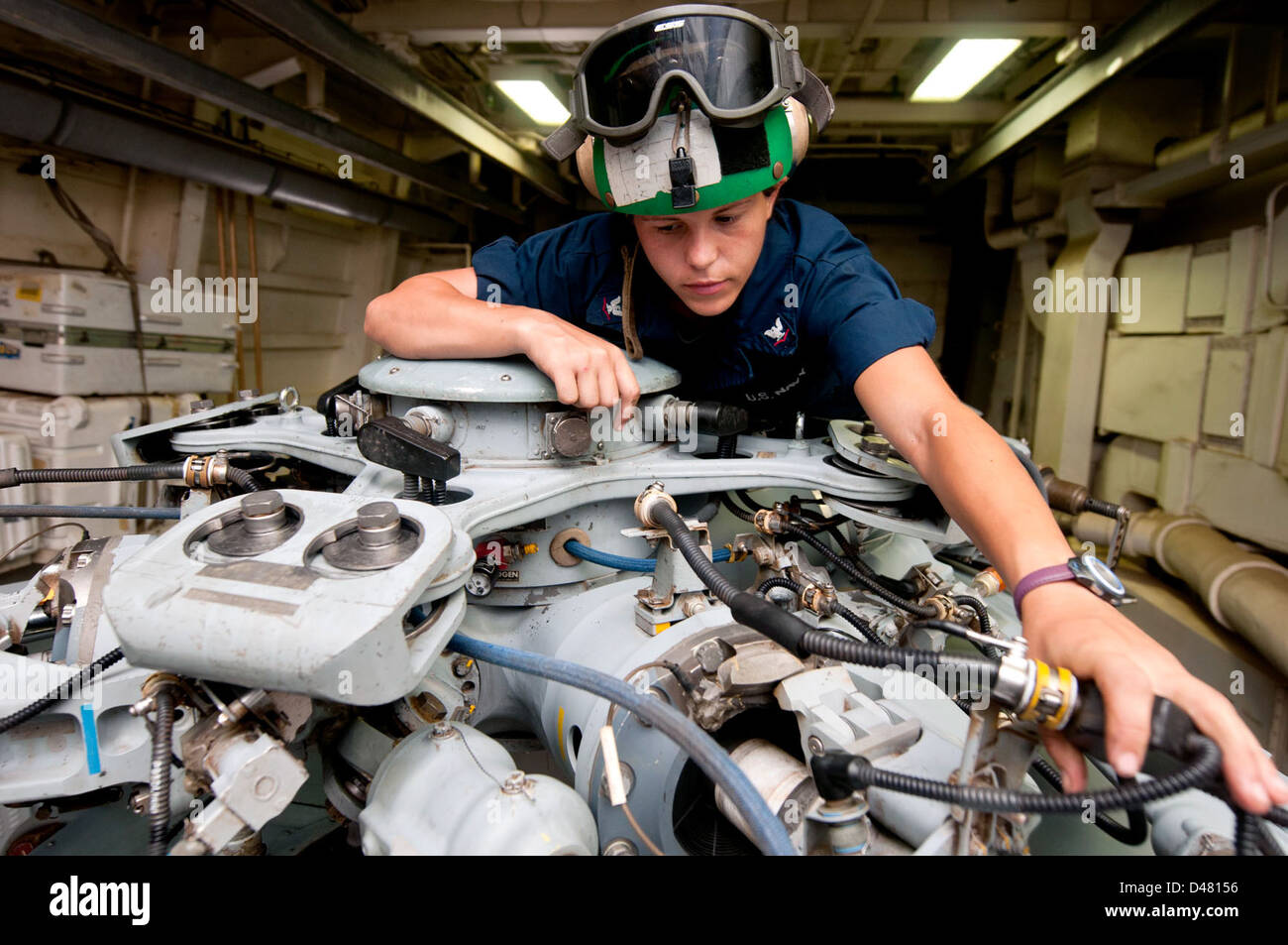 A Sailor aboard USS Winston Churchill (DDG-81) conducts a safety check ...