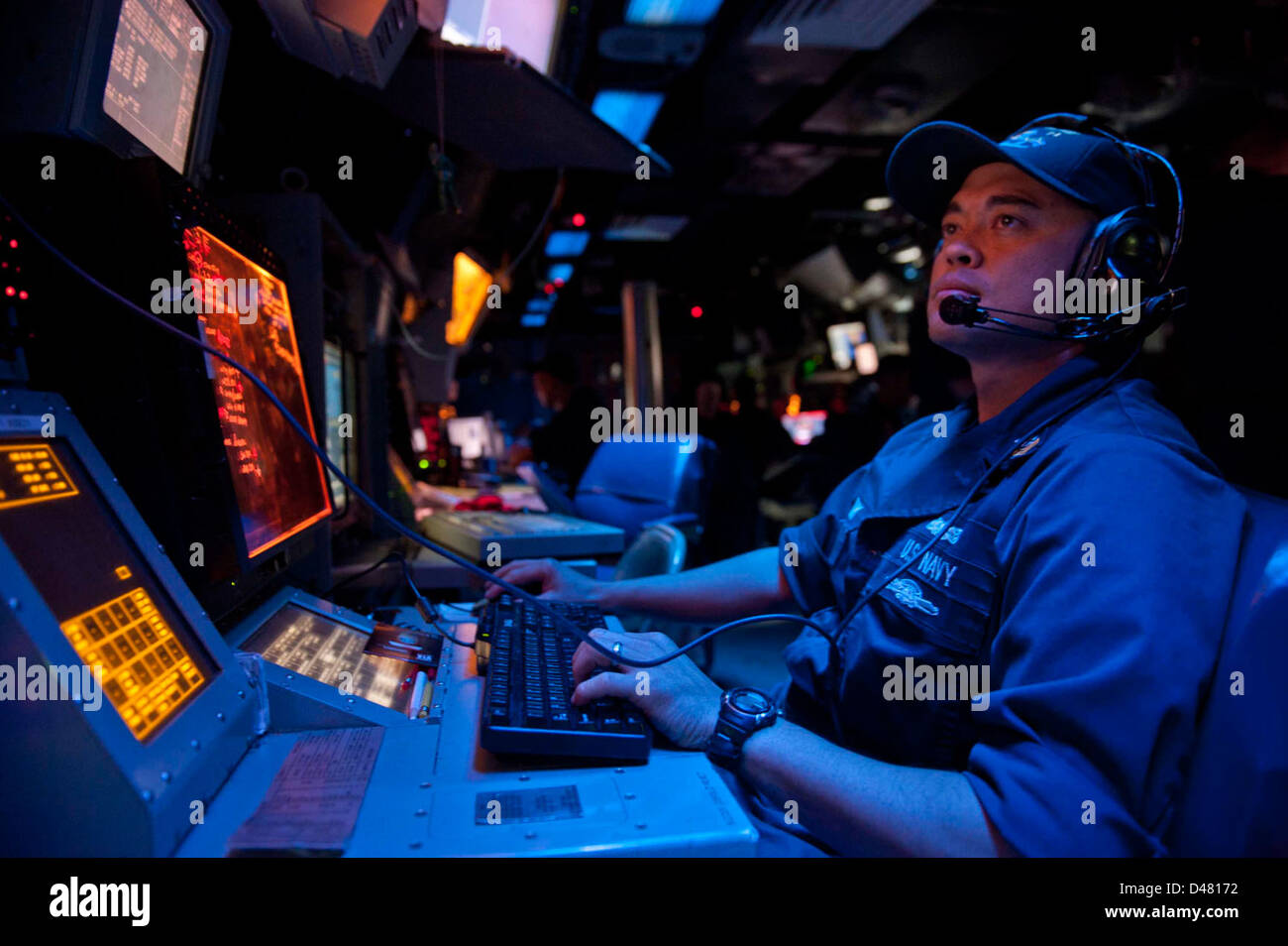 A U.S. Navy Sailor stands watch in the Pacific Ocean, ensuring security ...
