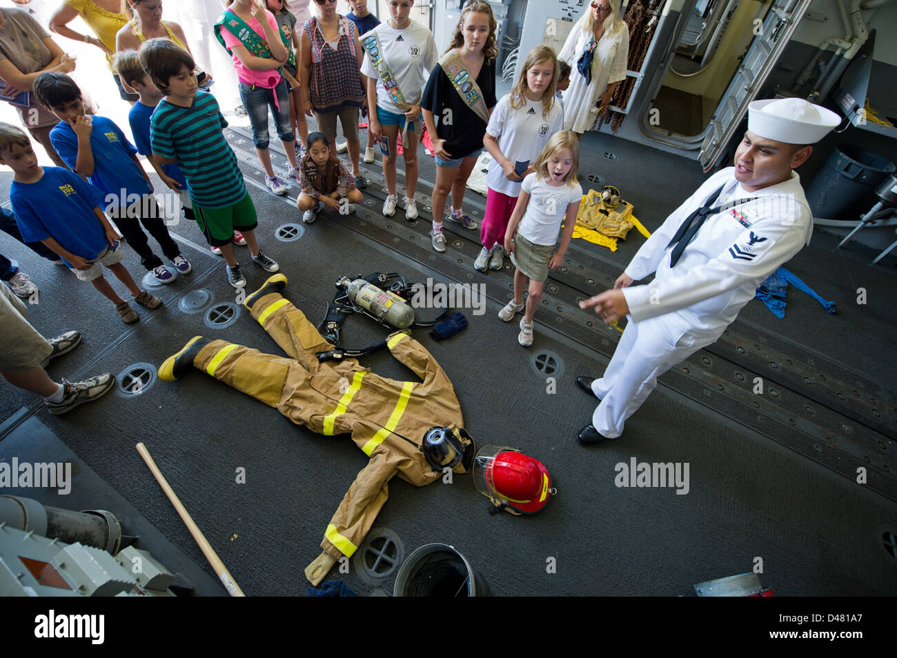 A Sailor gives a firefighting demonstration during the Navy Days tour ...
