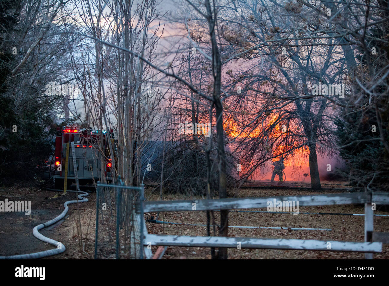 Firefighters battle a house fire in the town of Fernley Nevada Stock ...