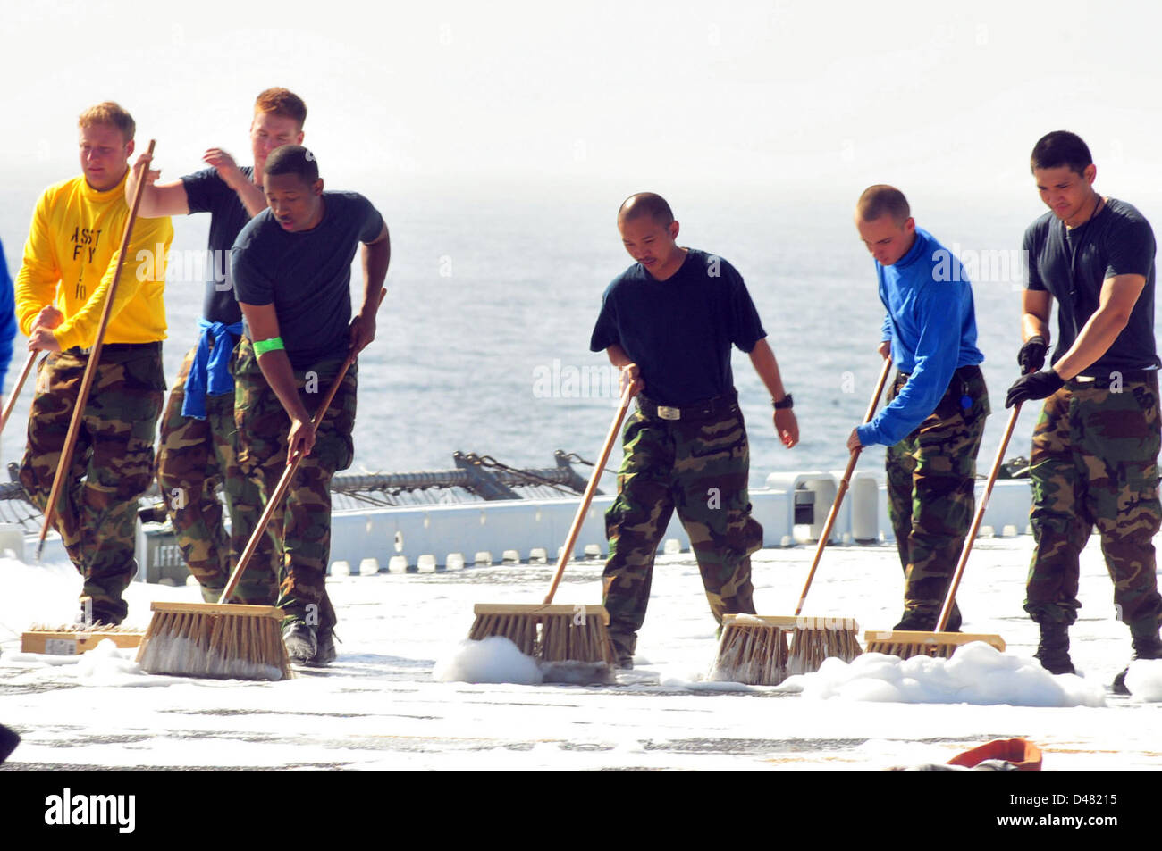 Sailors cleaning the deck of the ship hi-res stock photography and ...