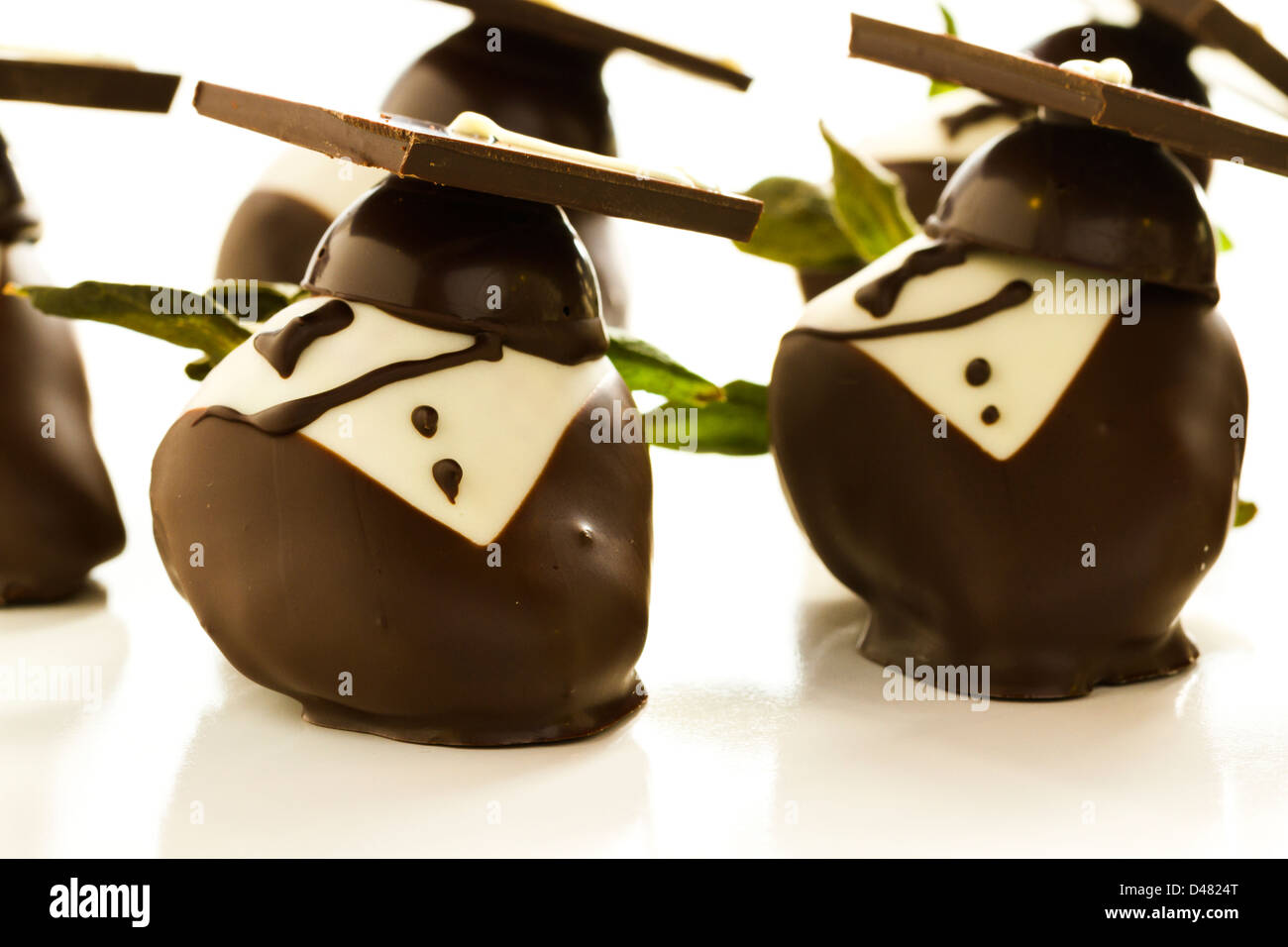 Gourmet chocolate covered strawberries decorated for graduation party ...