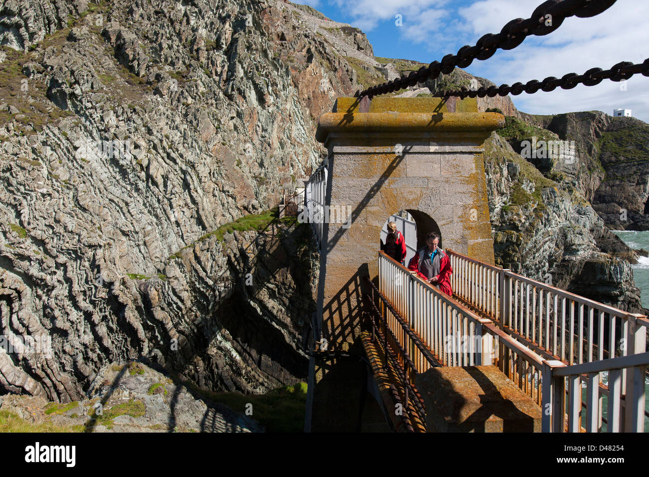The iron suspension bridge that connects South Stack lighthouse to the ...