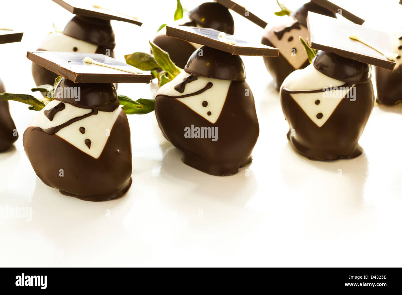Gourmet chocolate covered strawberries decorated for graduation party ...