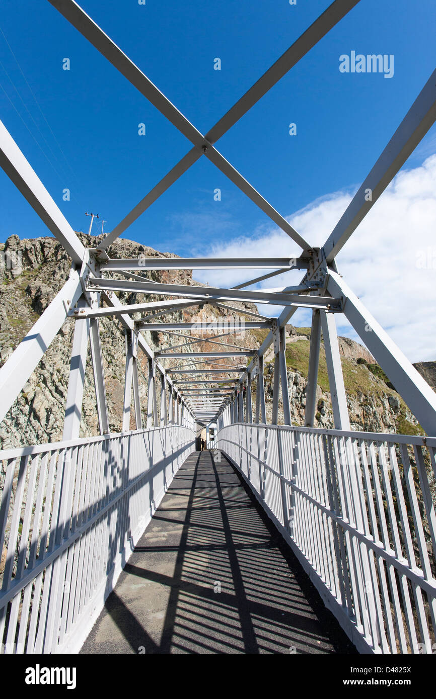 The iron suspension bridge that connects South Stack lighthouse to the ...