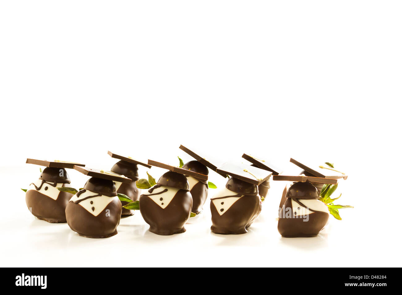 Gourmet chocolate covered strawberries decorated for graduation party ...