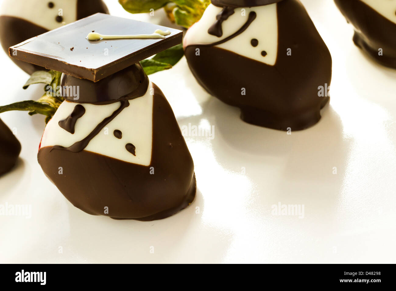 Gourmet chocolate covered strawberries decorated for graduation party ...