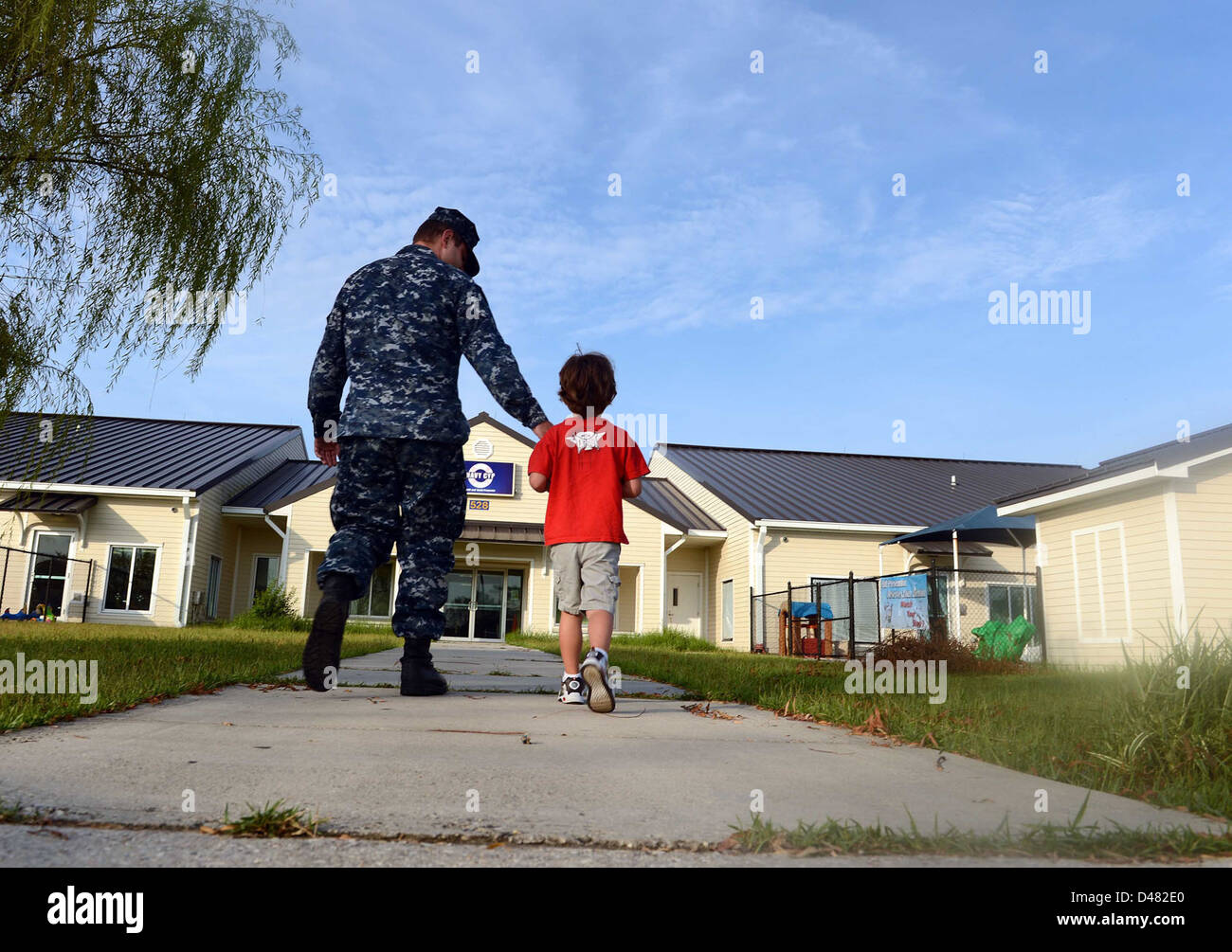 A Sailor drops off his child at the Child Development Center on base ...