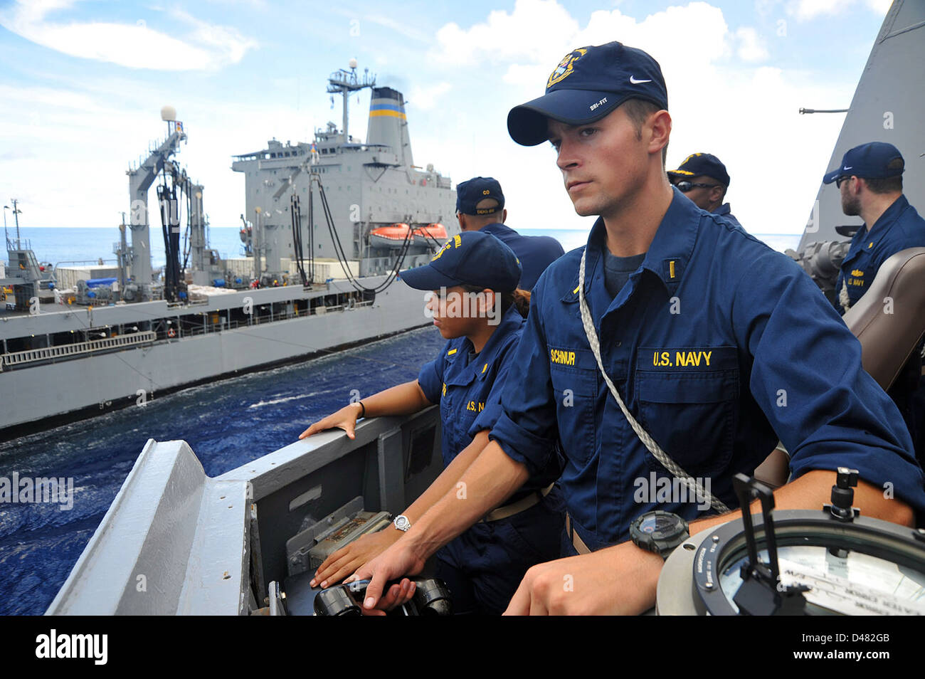 A Navy officer assumes the role of conning officer while navigating a ...