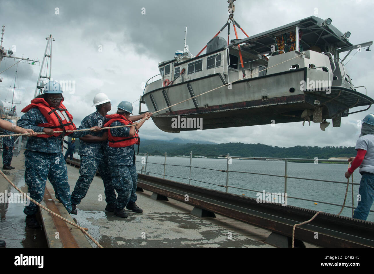 Sailors and civilian mariners aboard a vessel in Subic Bay, Philippines ...