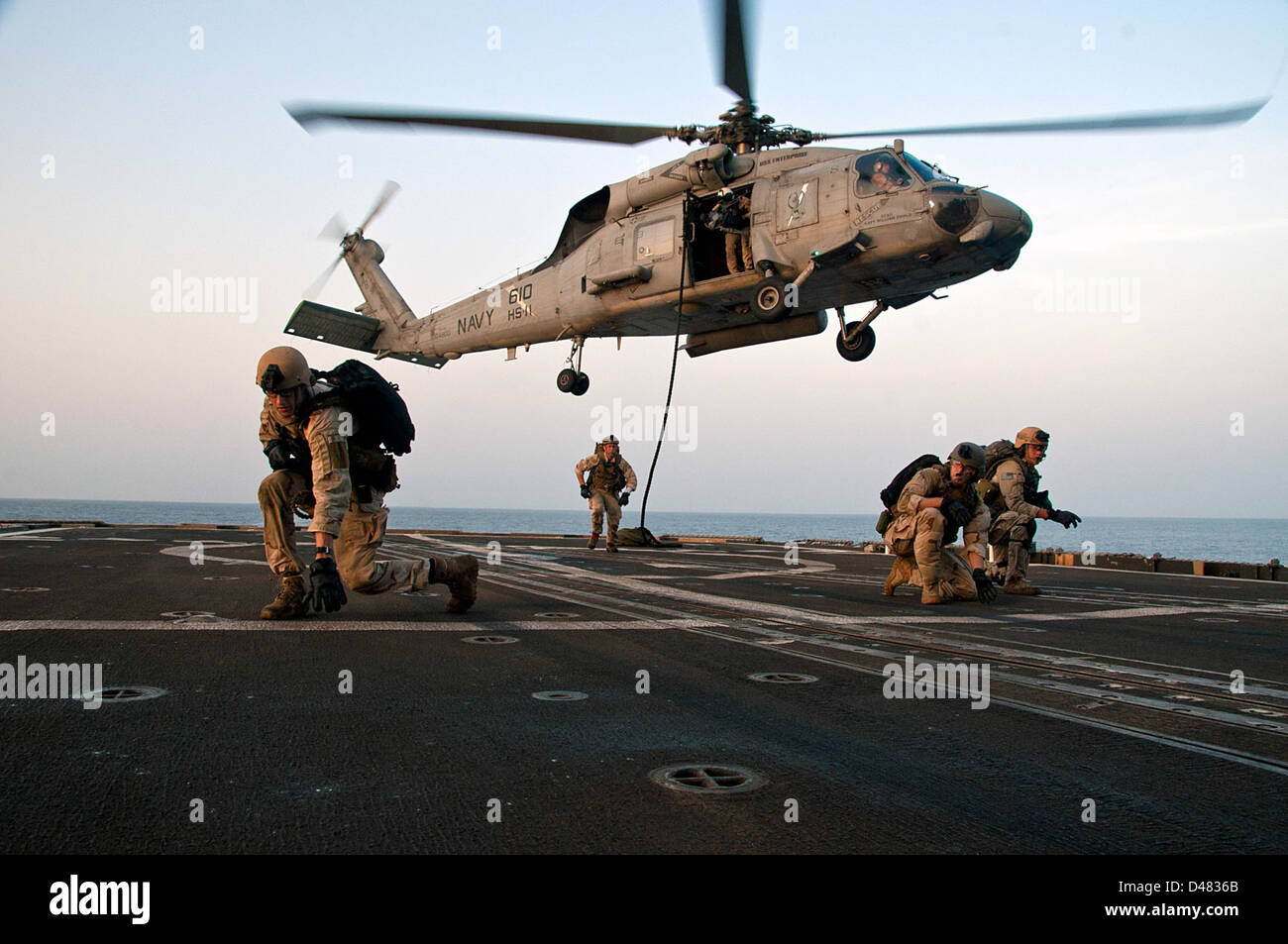 An Explosive Ordnance Disposal (EOD) team conducts training aboard a ...