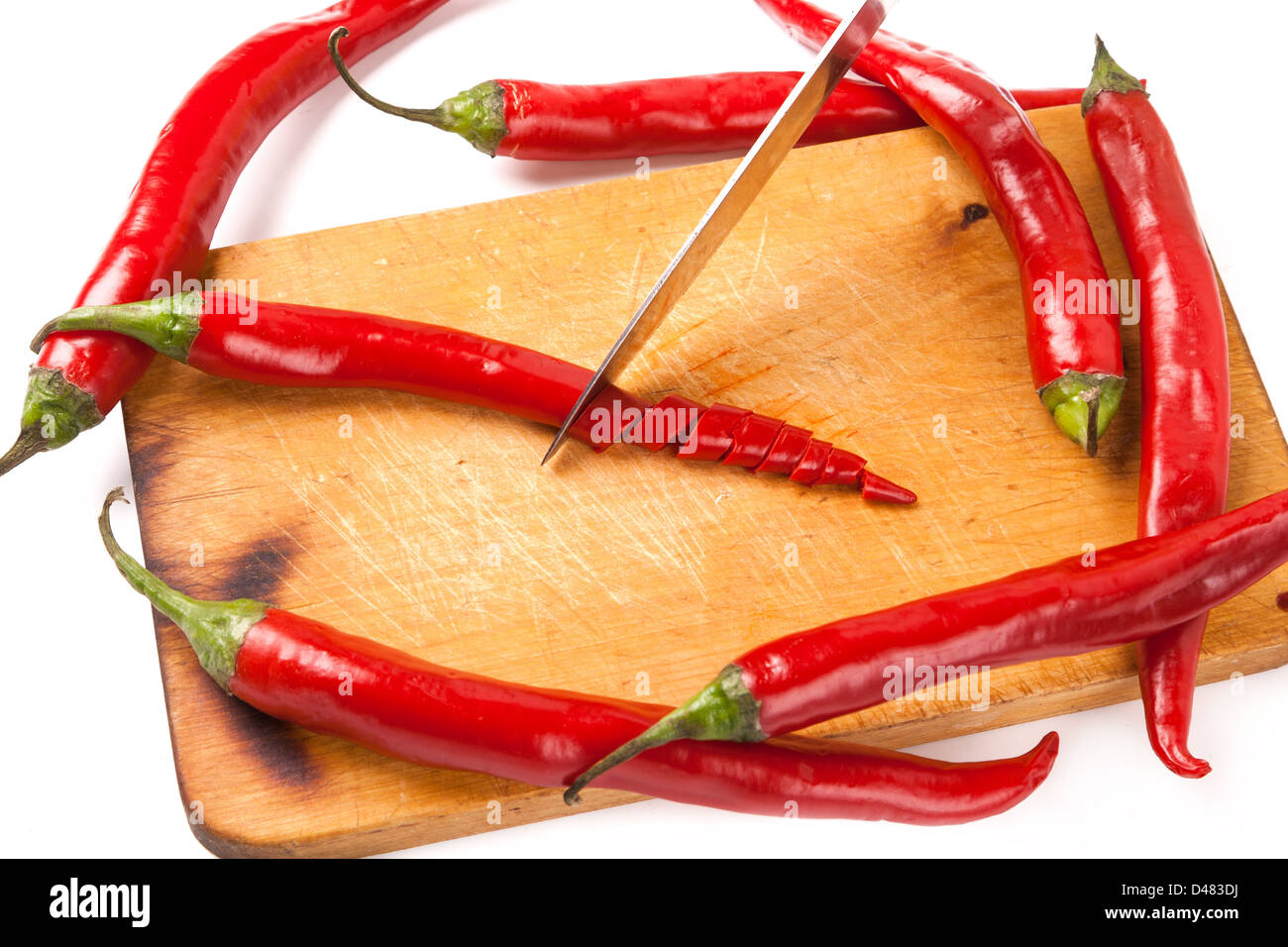 hot capsicum chili pepper and knife on wooden board Stock Photo - Alamy