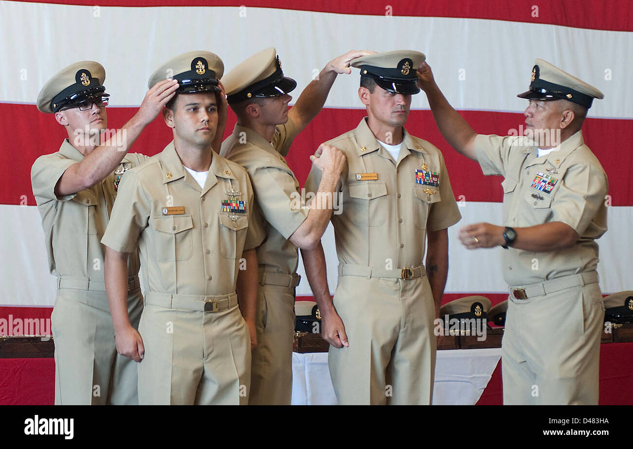 Newly promoted Navy chiefs receive their covers in a ceremony in San ...