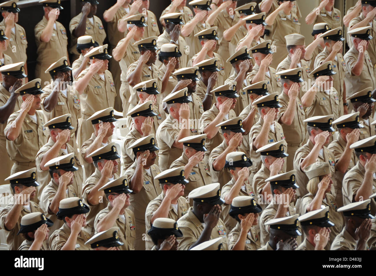 Chief Petty Officers salute during a pinning ceremony in Jacksonville ...