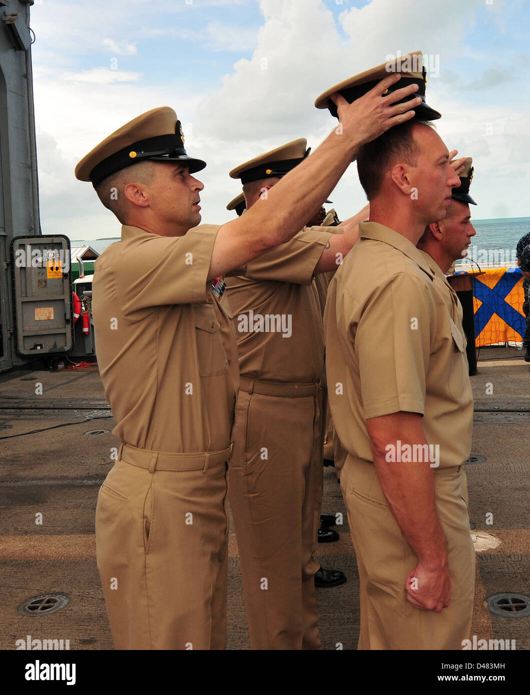 A new chief receives his combination cover, marking a significant ...
