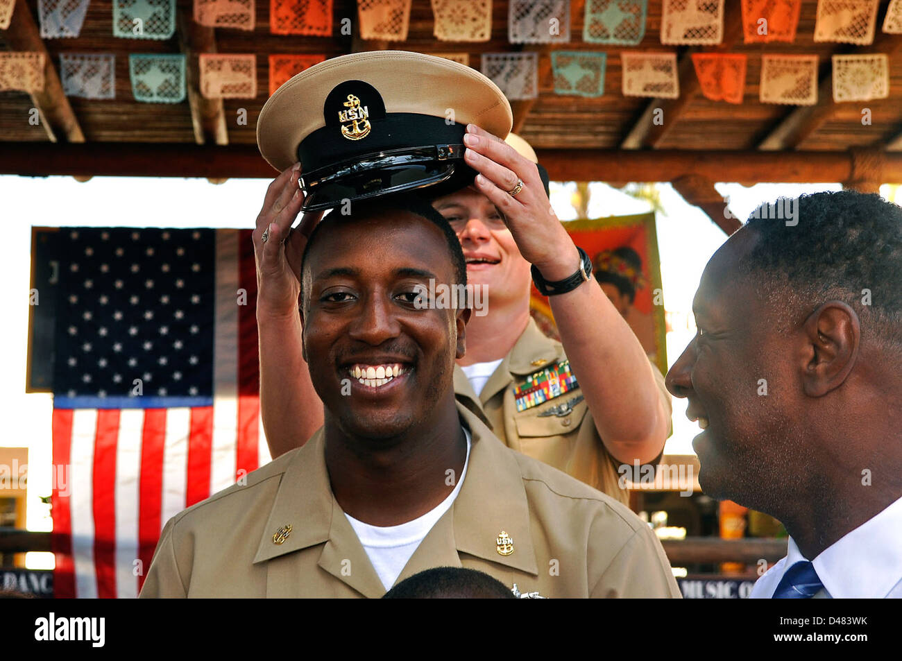 A U.S. Navy sailor in San Diego, California, receives his combination ...