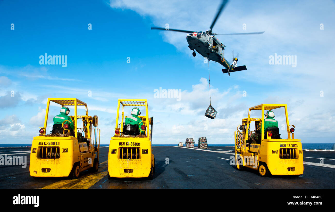 Helicopter delivers essential supplies hi-res stock photography and ...
