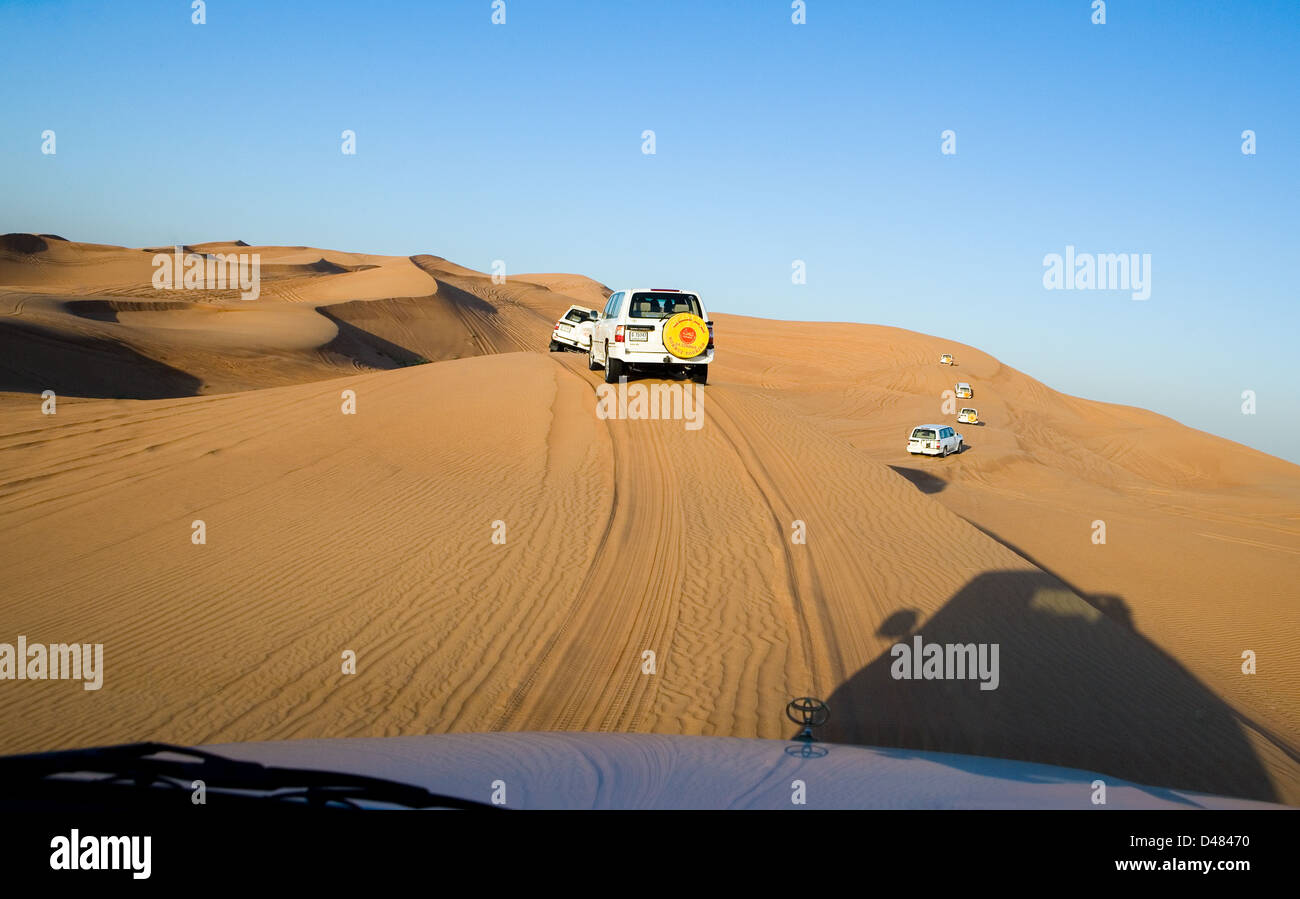Dubai, off the road cars in the Al Dhana desertic area Stock Photo - Alamy