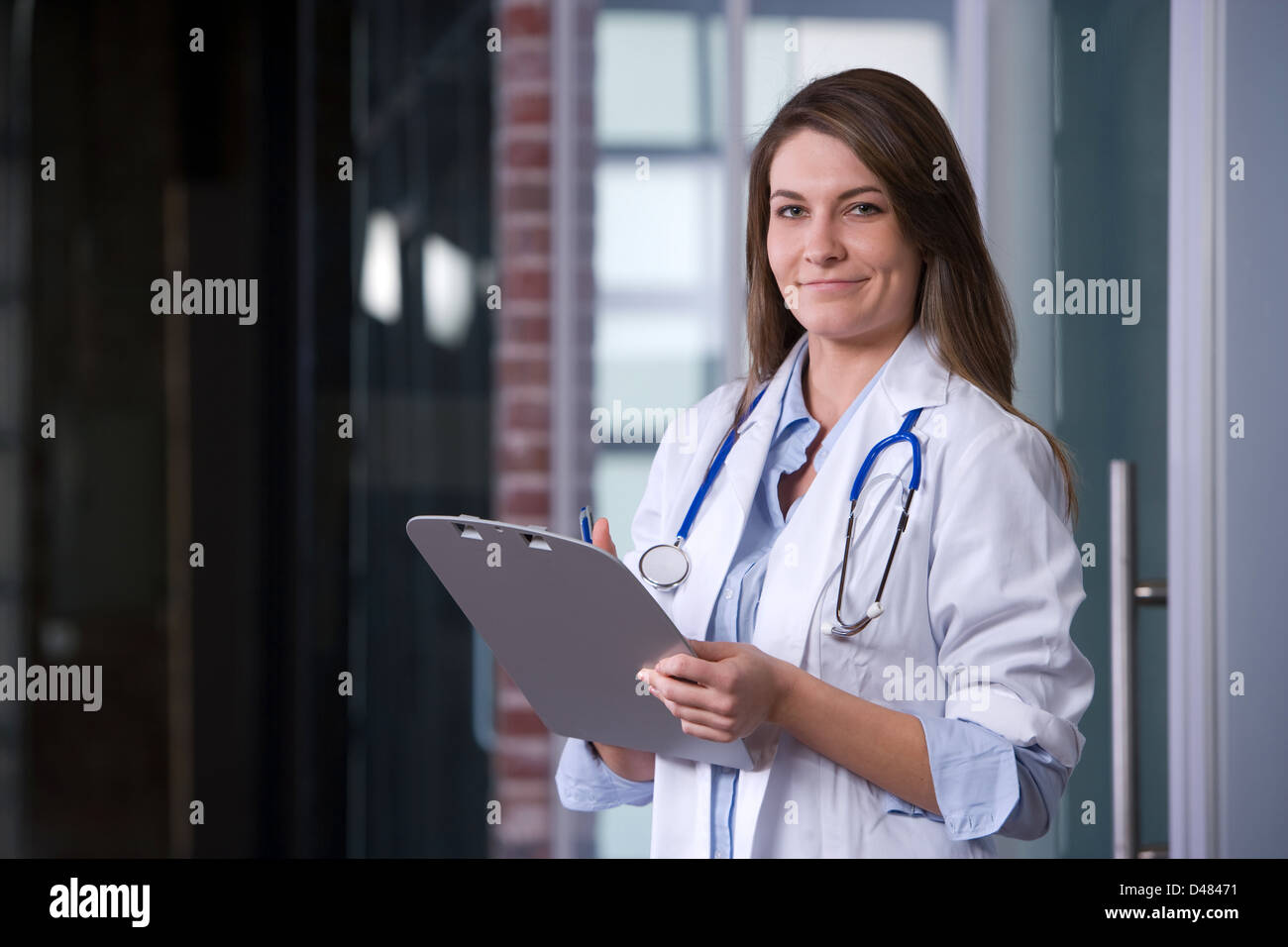 Female Doctor in modern office Stock Photo - Alamy