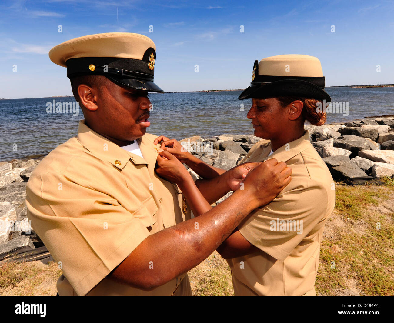 Married Navy chiefs participate in a pinning ceremony, where they ...