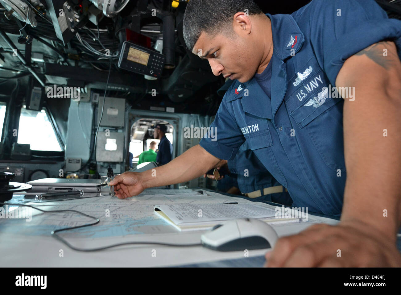 Sailor tracks ship's position Stock Photo - Alamy