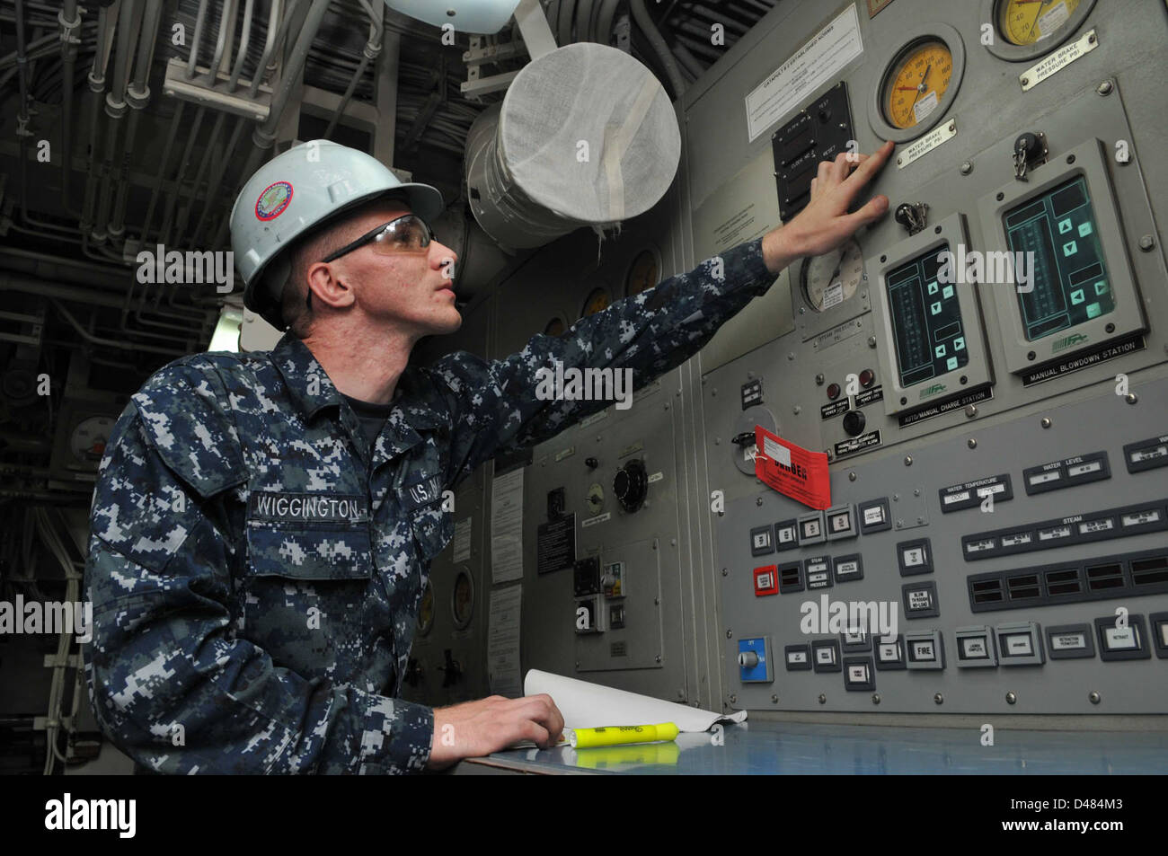 A Sailor inspects steam gauges aboard a vessel at Naval Base Kitsap ...