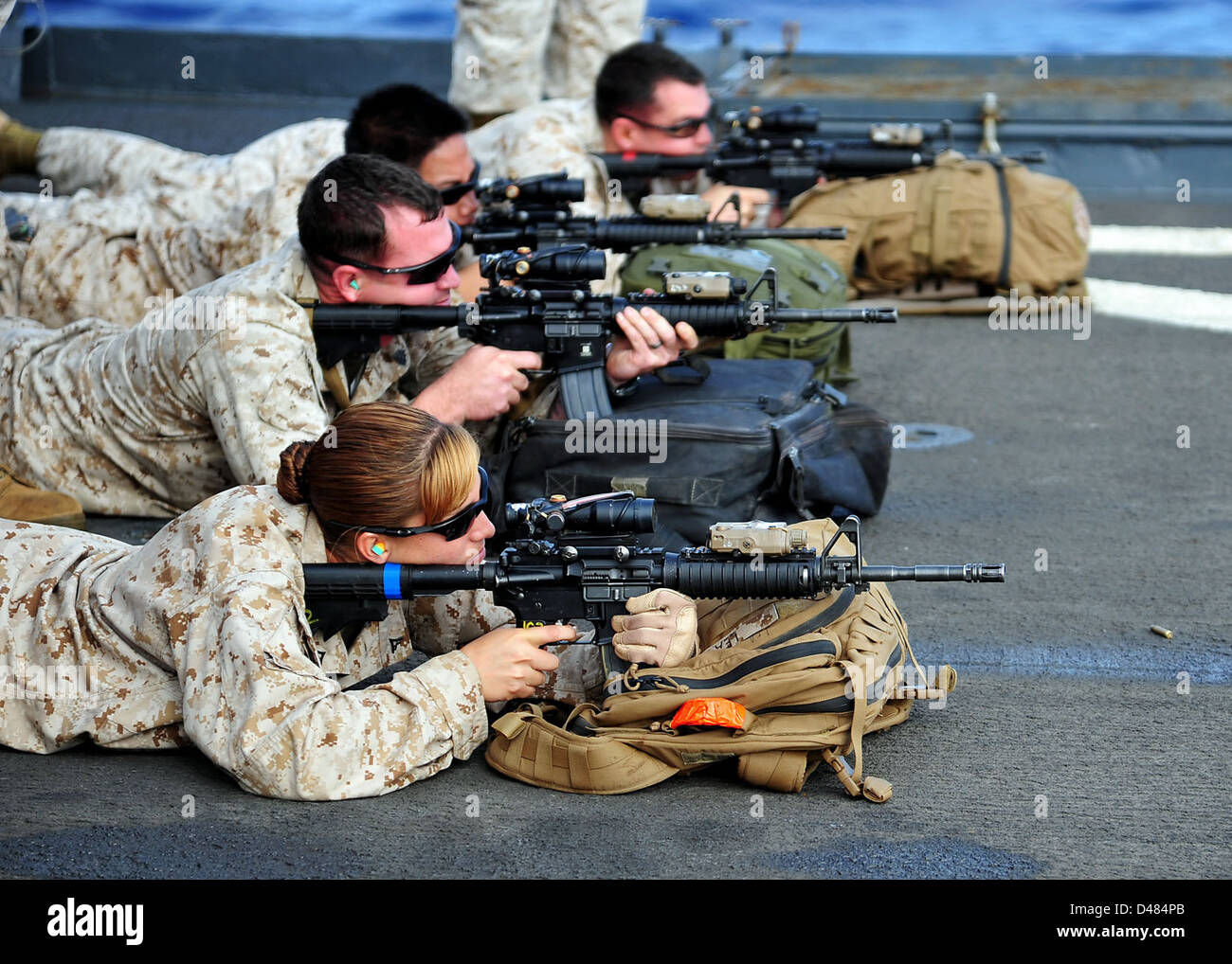 Marines aboard the USS Rushmore conduct rifle training during an ...
