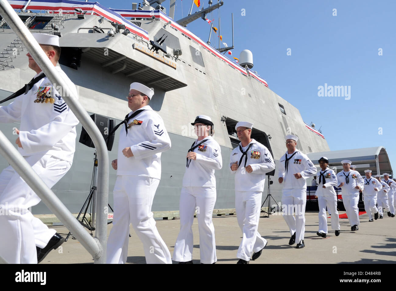 Sailors run aboard USS Forth Worth Stock Photo - Alamy