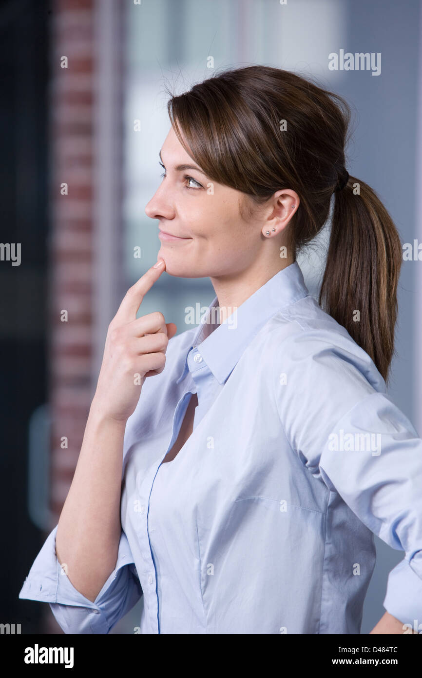 Business woman thinking Stock Photo - Alamy