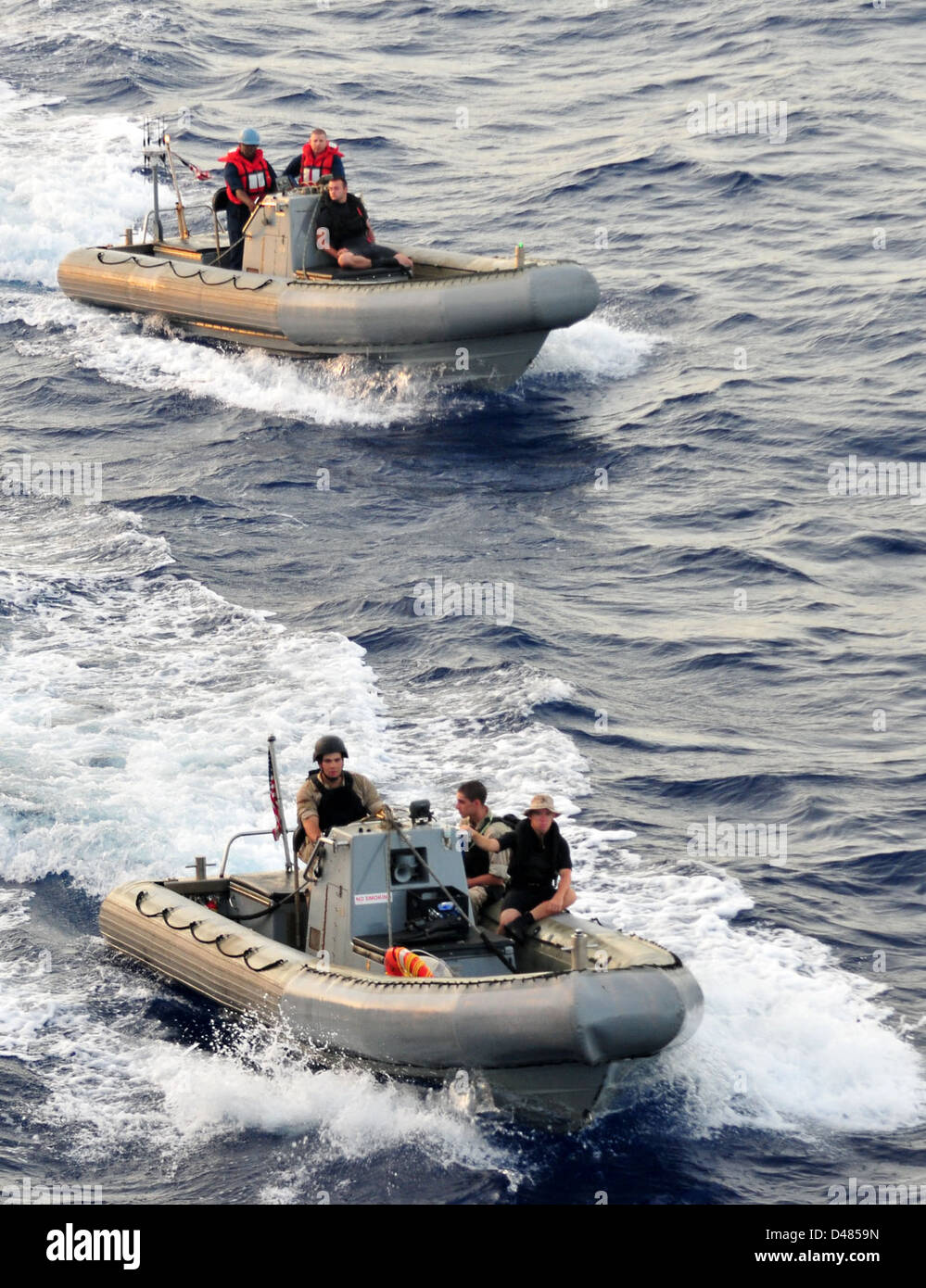 U.S. Navy VBSS (Visit, Board, Search, and Seizure) teams conduct ...