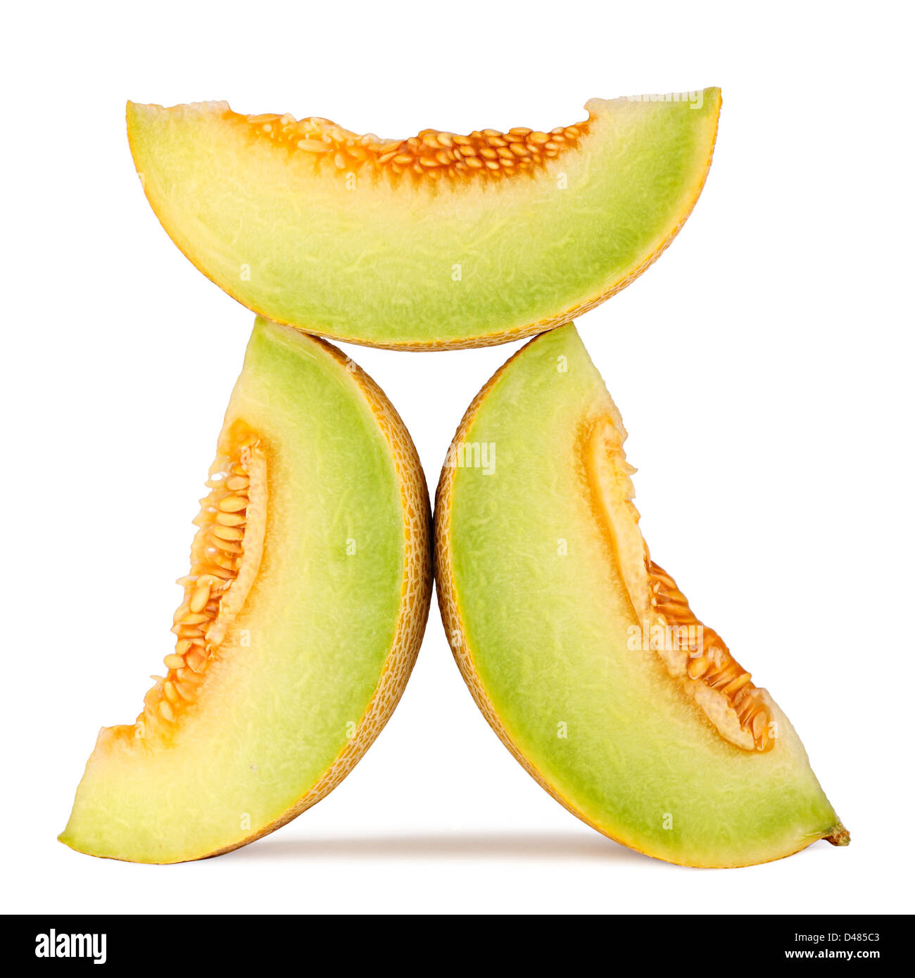 three galia honey melon slices on white background Stock Photo - Alamy