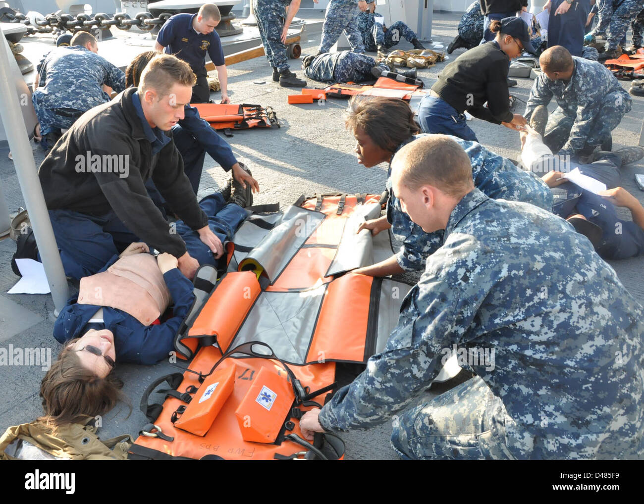 Sailors aboard a U.S. Navy ship conduct a training exercise in the ...
