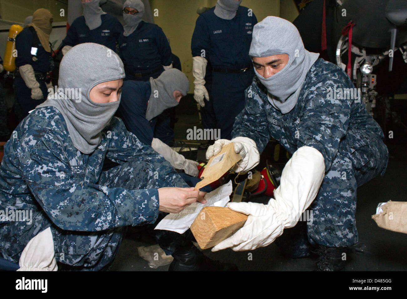 U.S. Navy sailors perform a drill aboard the USS George Washington ...