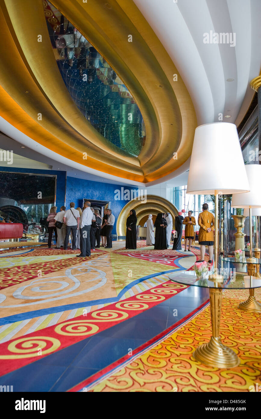 Dubai, the colored reception hall of the luxury Burj Al Arab hotel ...
