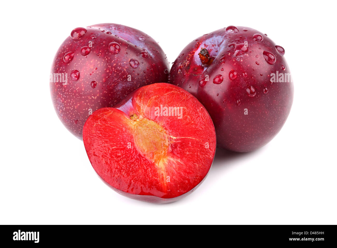 Three fresh purple plums Cut Out Stock Images & Pictures - Alamy