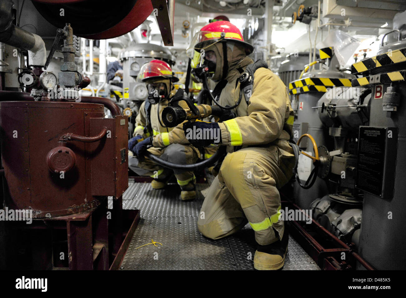 Sailors engage in a simulated fire response exercise in the Red Sea ...