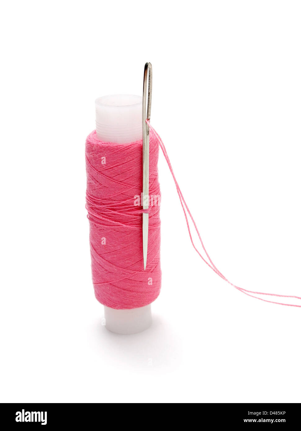 Spool and needle isolated on white Stock Photo - Alamy