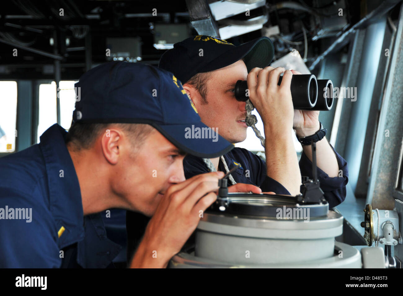 Sailors stand watch on the bridge Stock Photo - Alamy