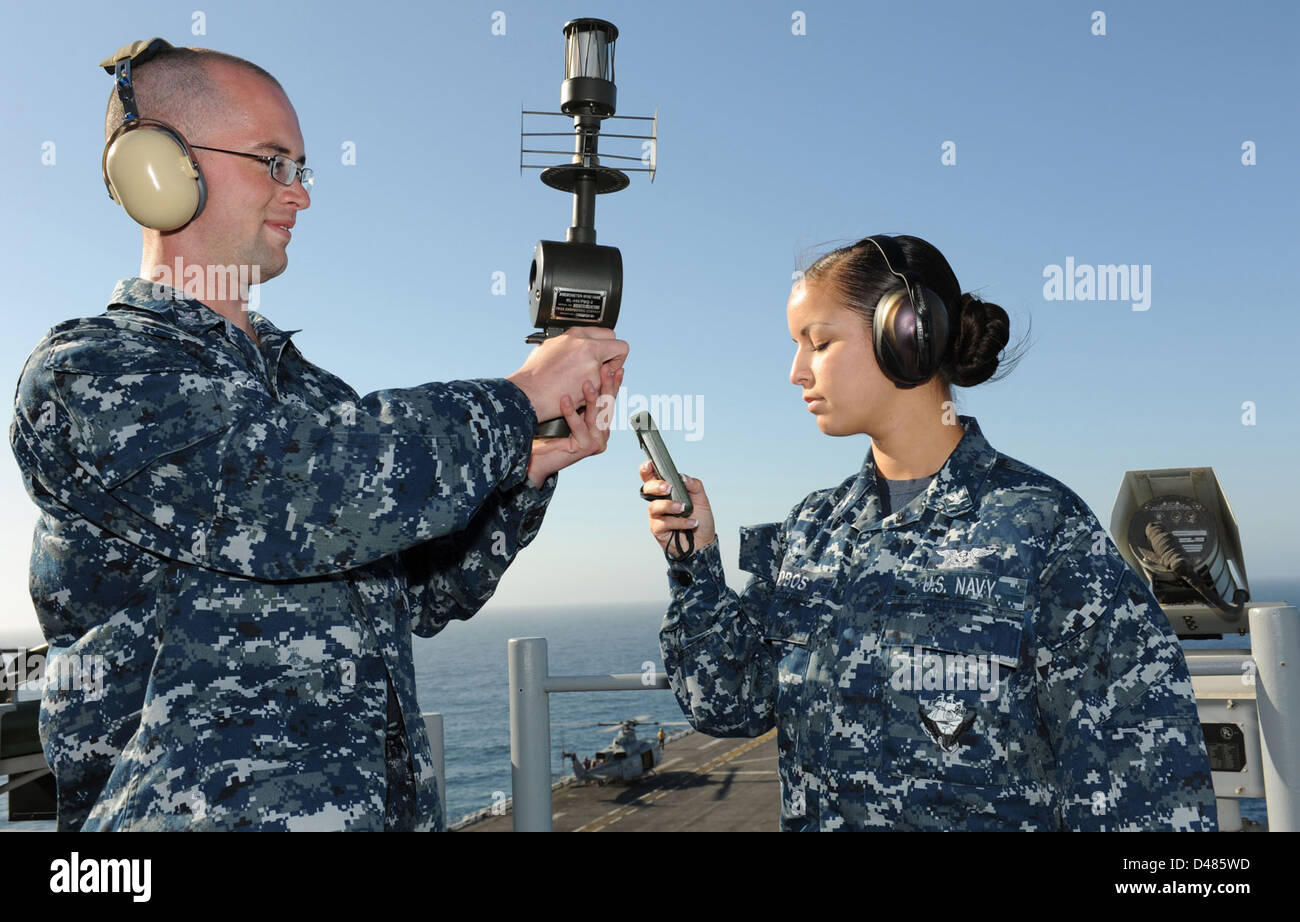 Sailors check the weather Stock Photo - Alamy