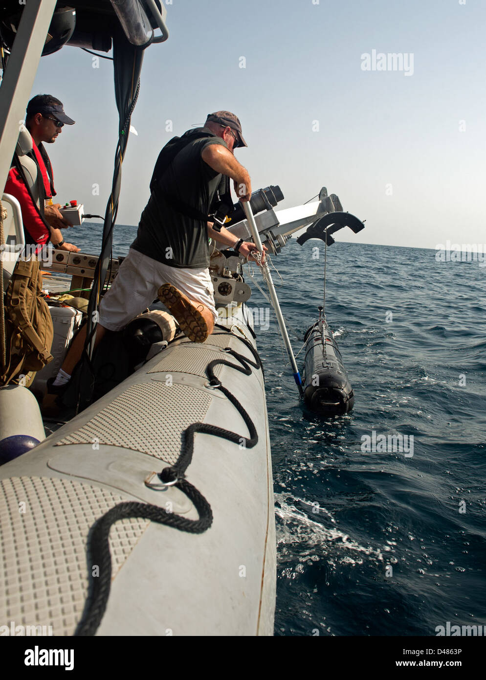 A UUV (Unmanned Underwater Vehicle) is deployed during a mine detection ...