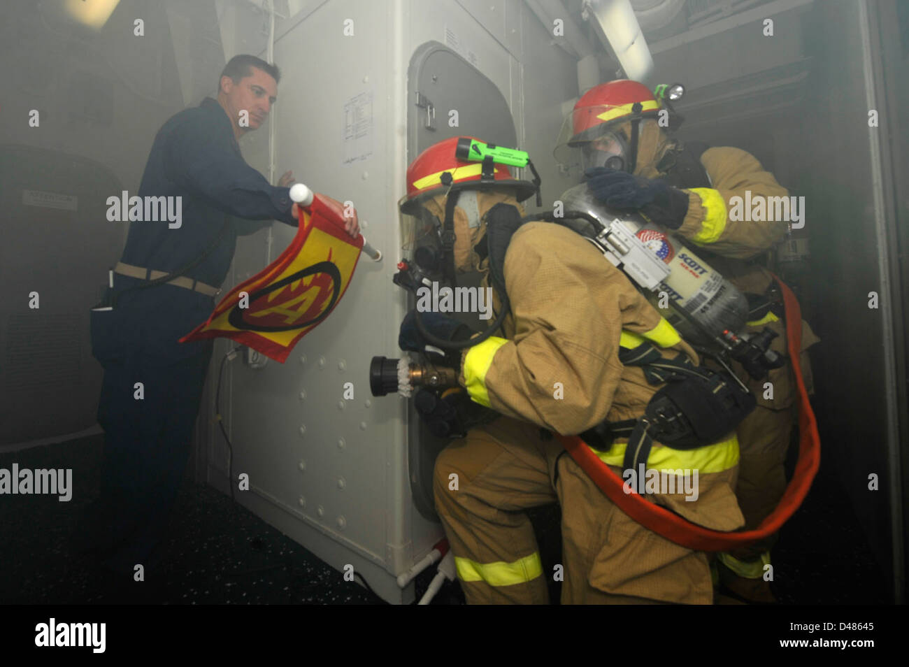 Sailors practice firefighting at sea Stock Photo - Alamy