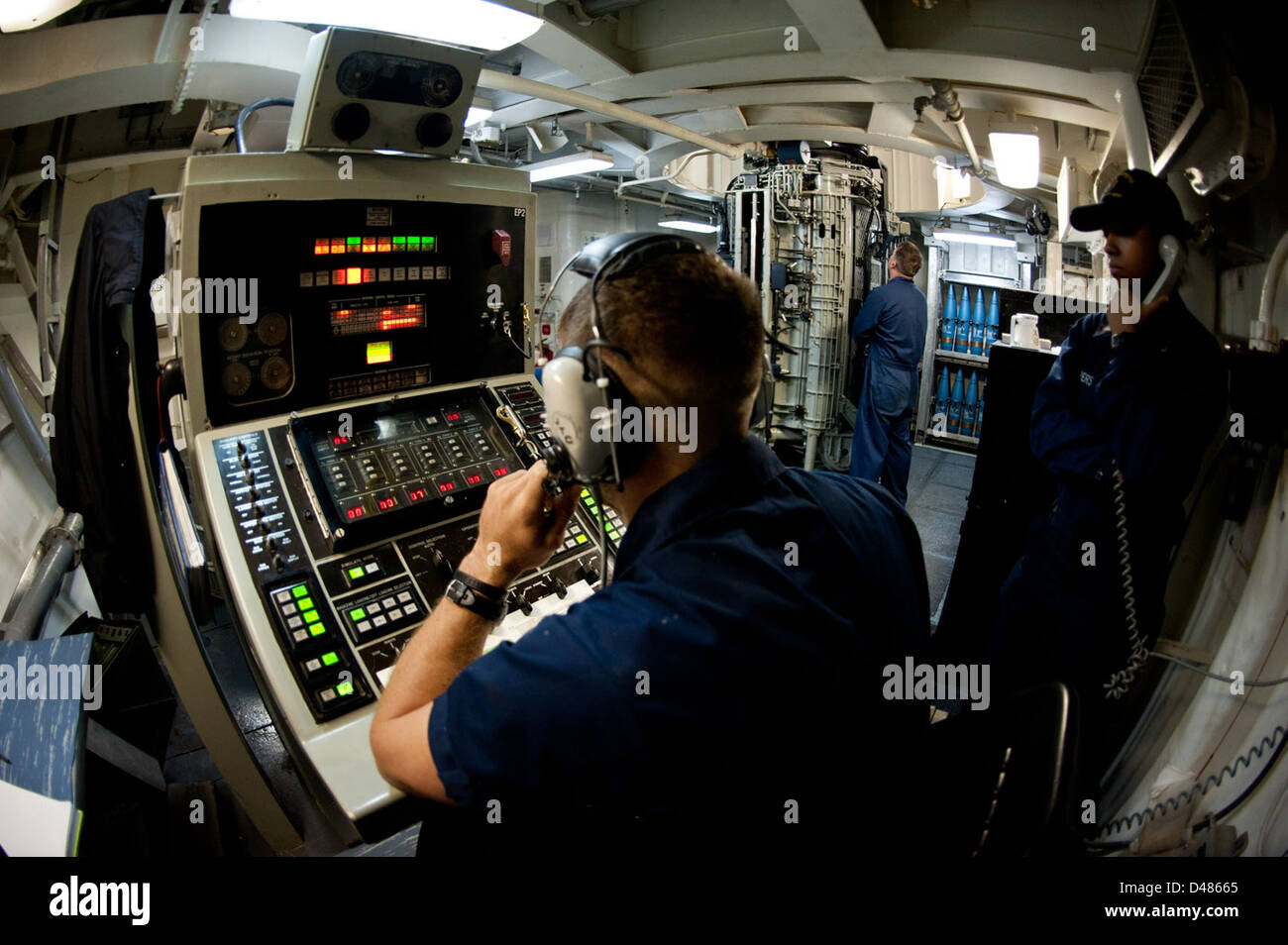 A Sailor monitors weapon systems during a deployment in the South China ...