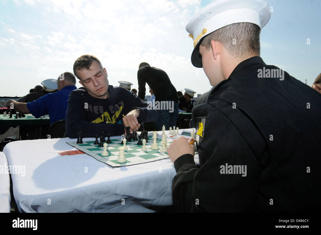 Sailors aboard the USS Wasp play chess as part of their recreational ...