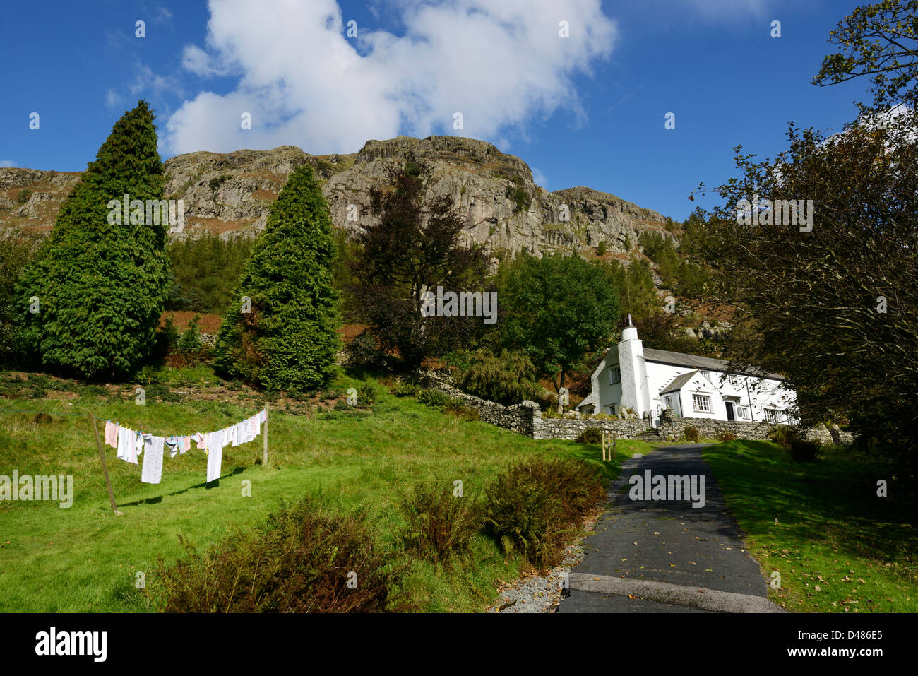 White washed cottage and clothes drying on a washing line,Great ...