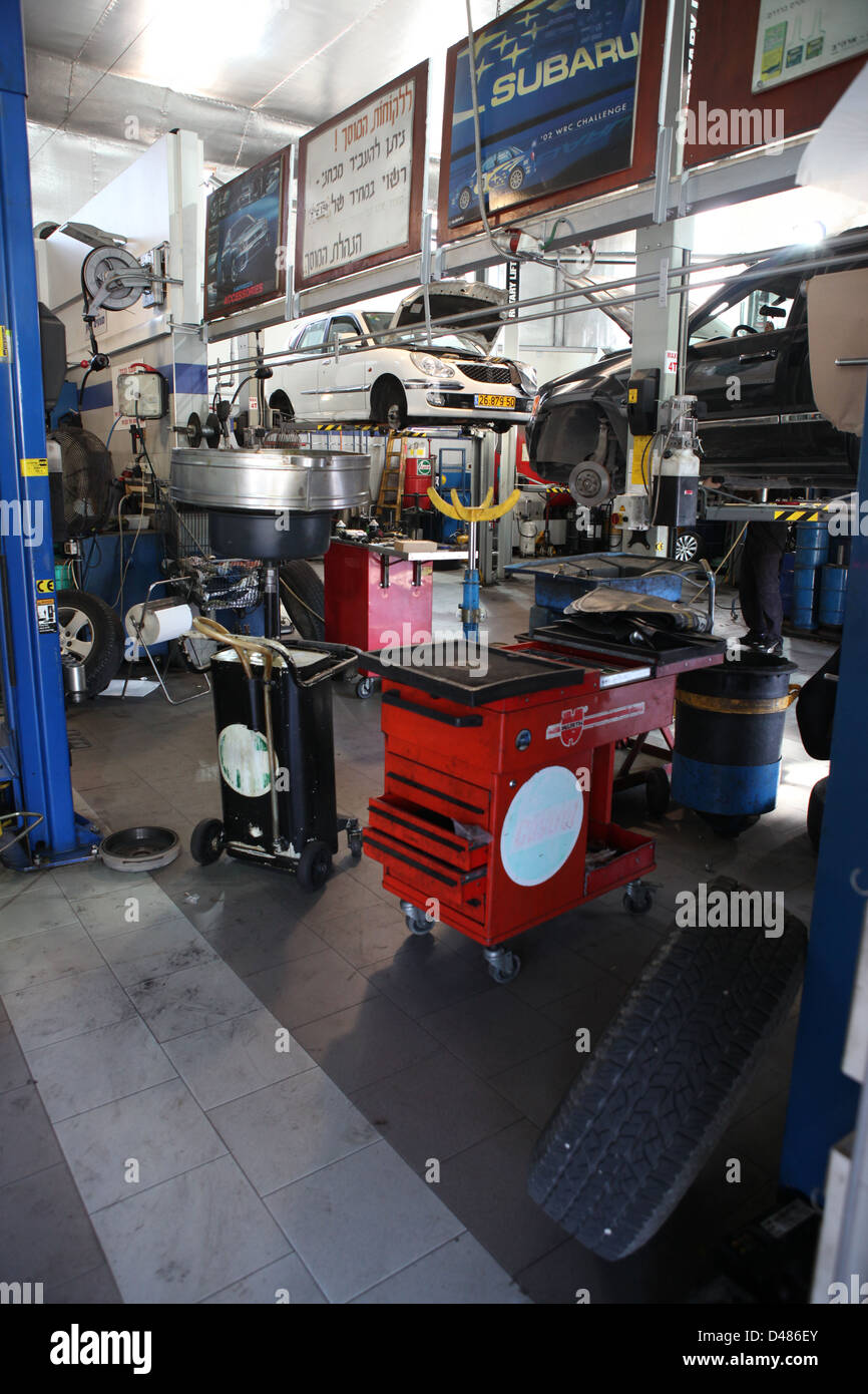 Car being serviced at a repair shop Stock Photo - Alamy