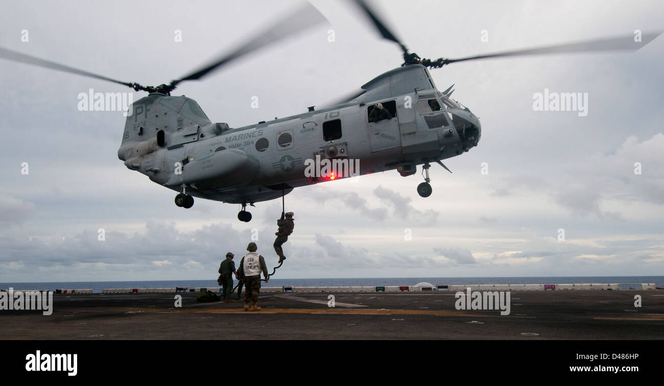 Marines perform a fast-roping exercise from a helicopter in the Pacific ...